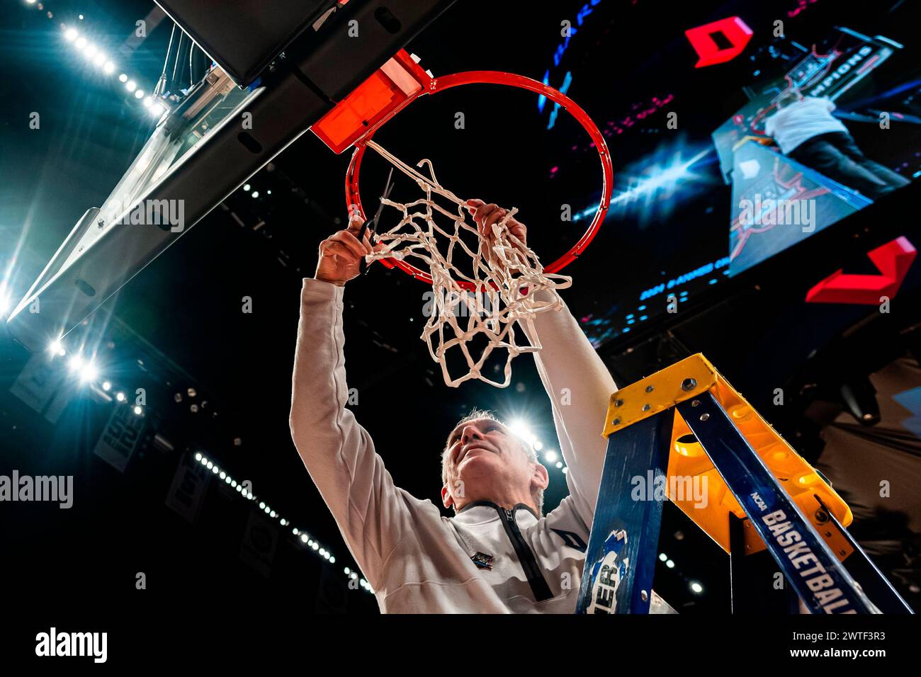 Duquesne head coach Keith Dambrot cuts the net after an NCAA college ...