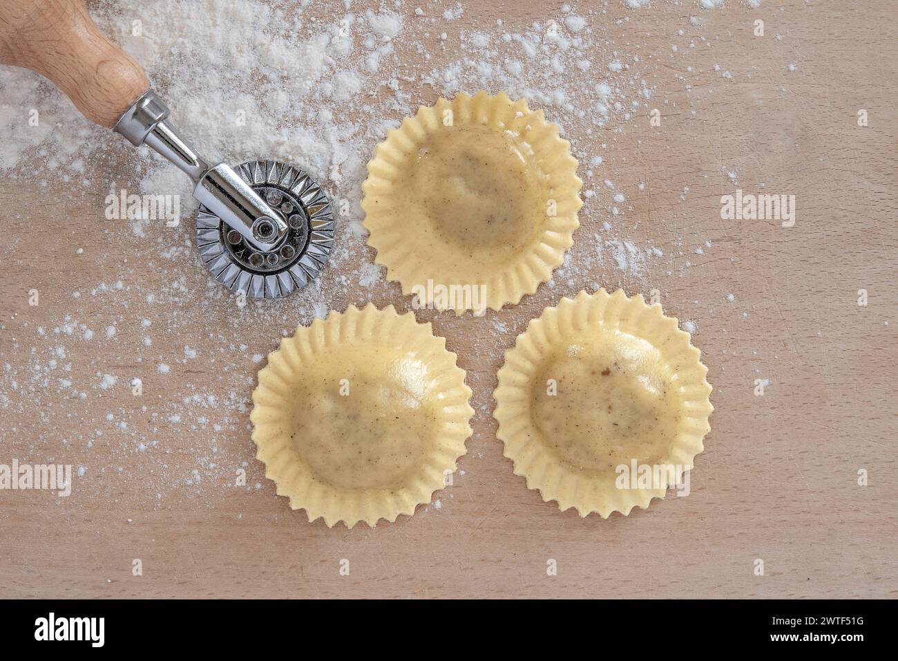 Homemade preparation of round raviole Stock Photo - Alamy