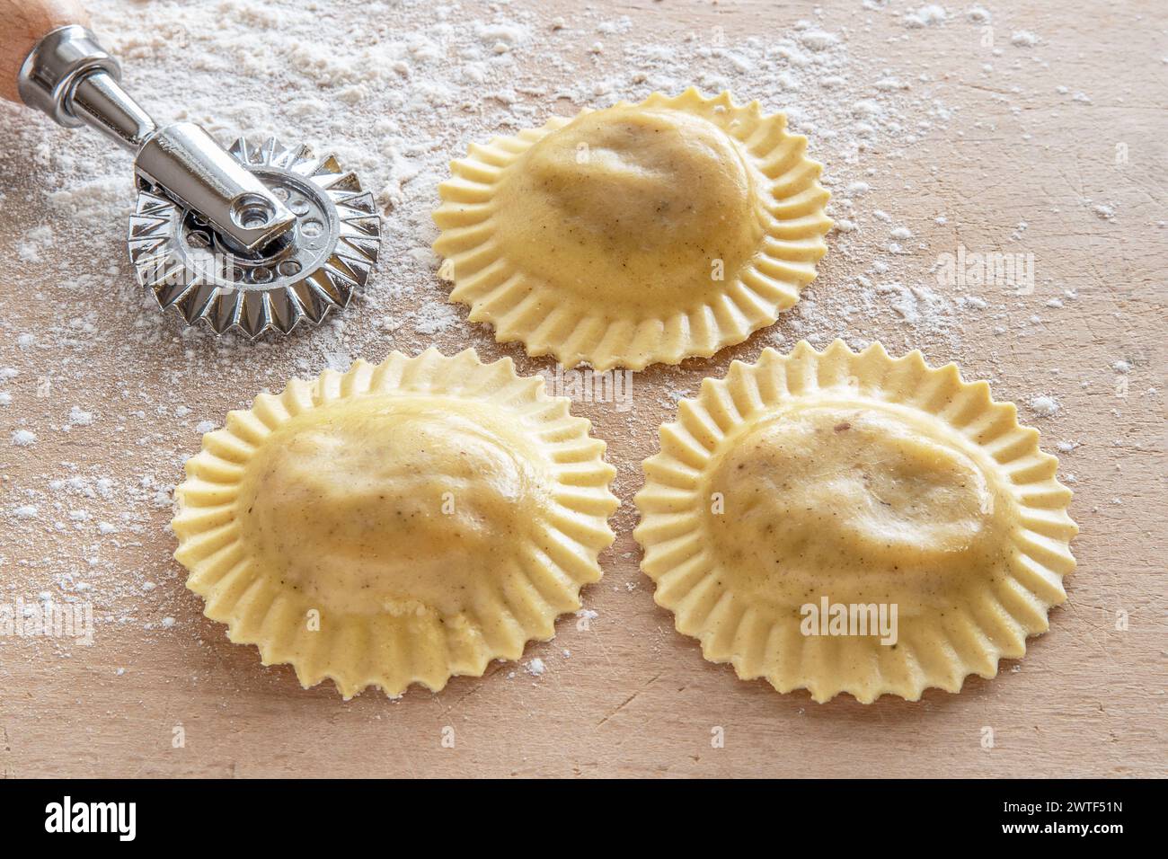 Homemade preparation of round raviole Stock Photo - Alamy