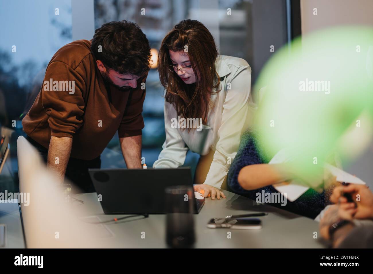 Business colleagues engage in a thought-provoking meeting, highlighting ...