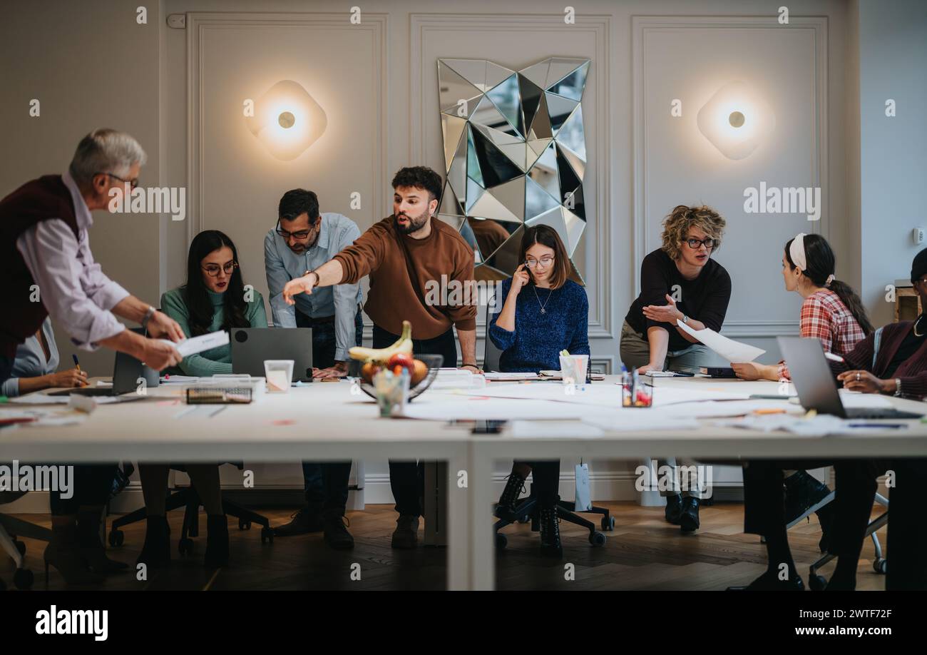 Animated group of diverse colleagues collaborating in a business ...