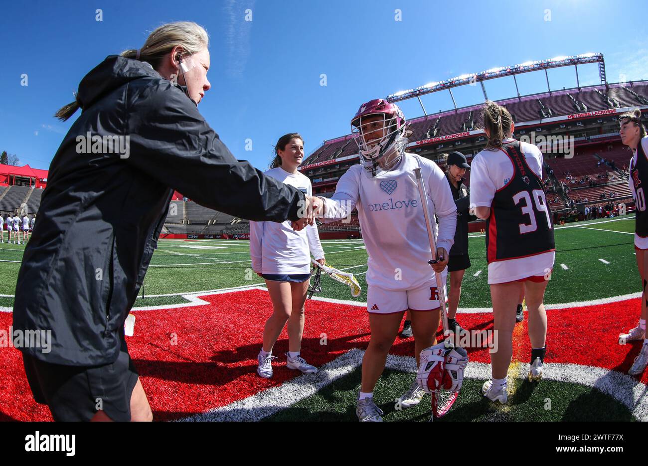 March 17, 2024: Rutgers goalie Sophia Cardello (28) greets the referees ...