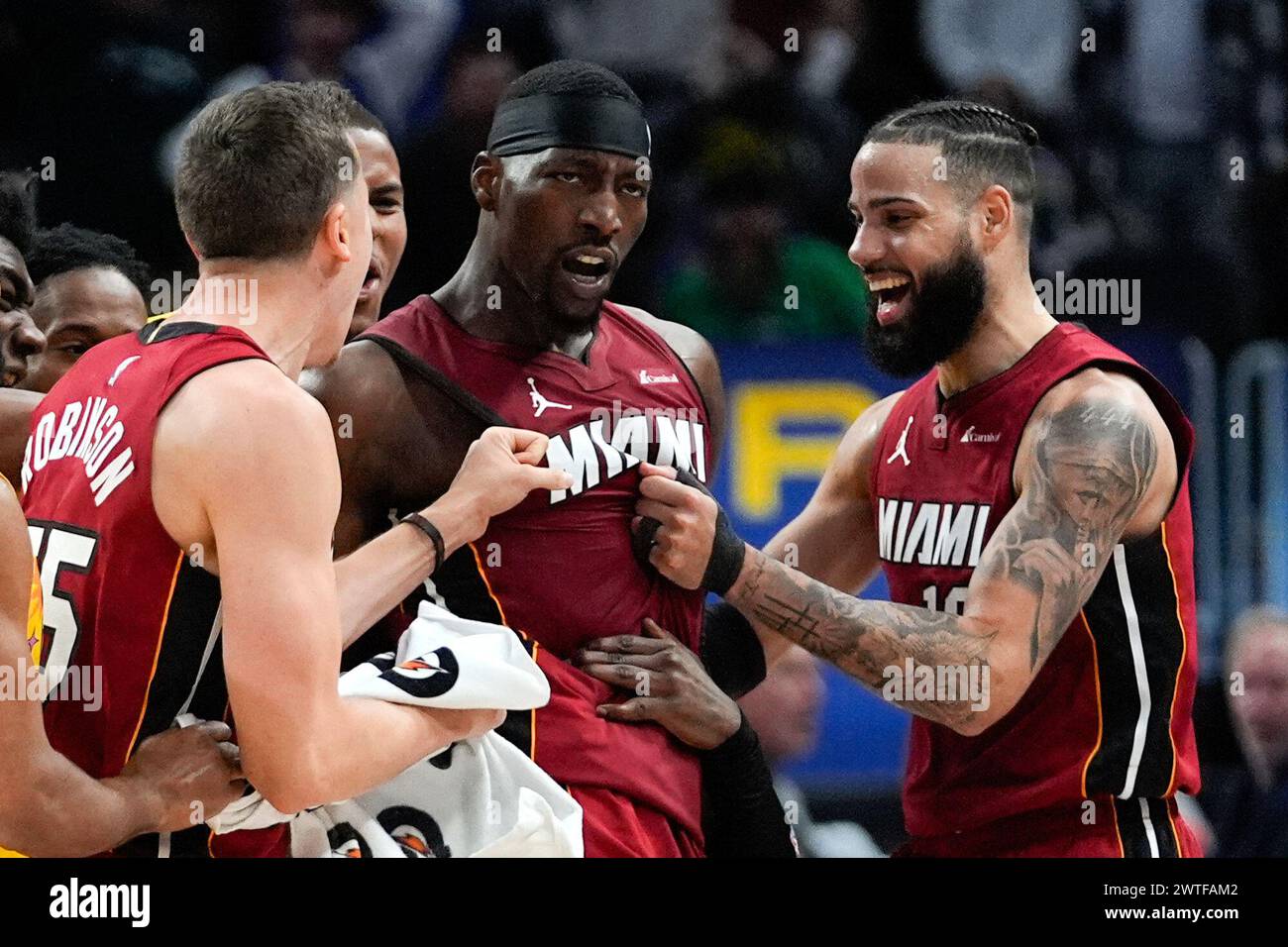 Miami Heat center Bam Adebayo, center, celebrates his game winning shot ...