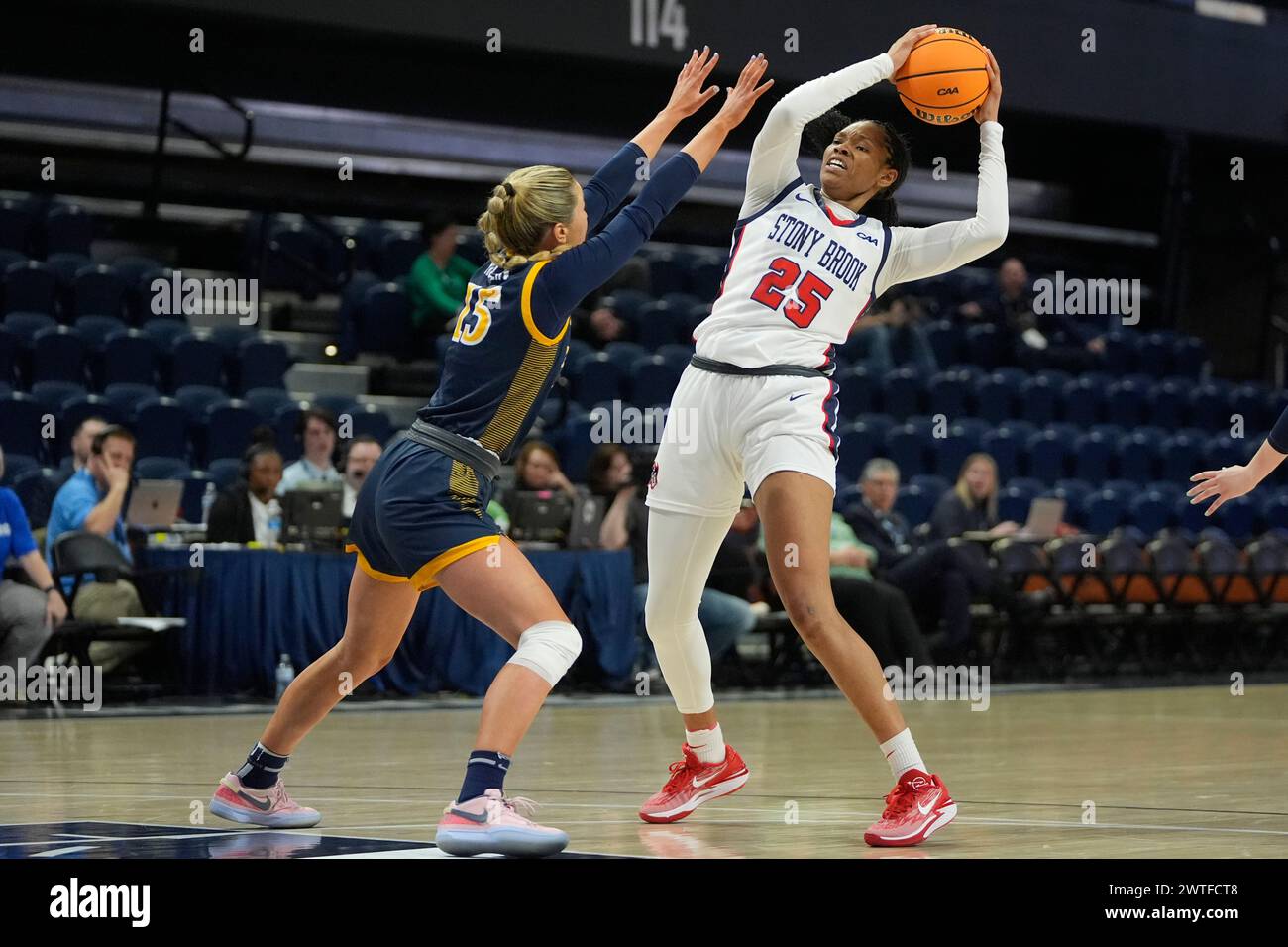 Stony Brook forward Khari Clark (25) looks to pass around Drexel guard ...