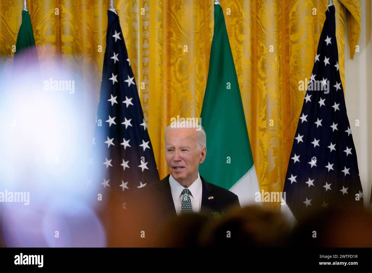 President Joe Biden speaks during a St. Patrick's Day reception in the ...