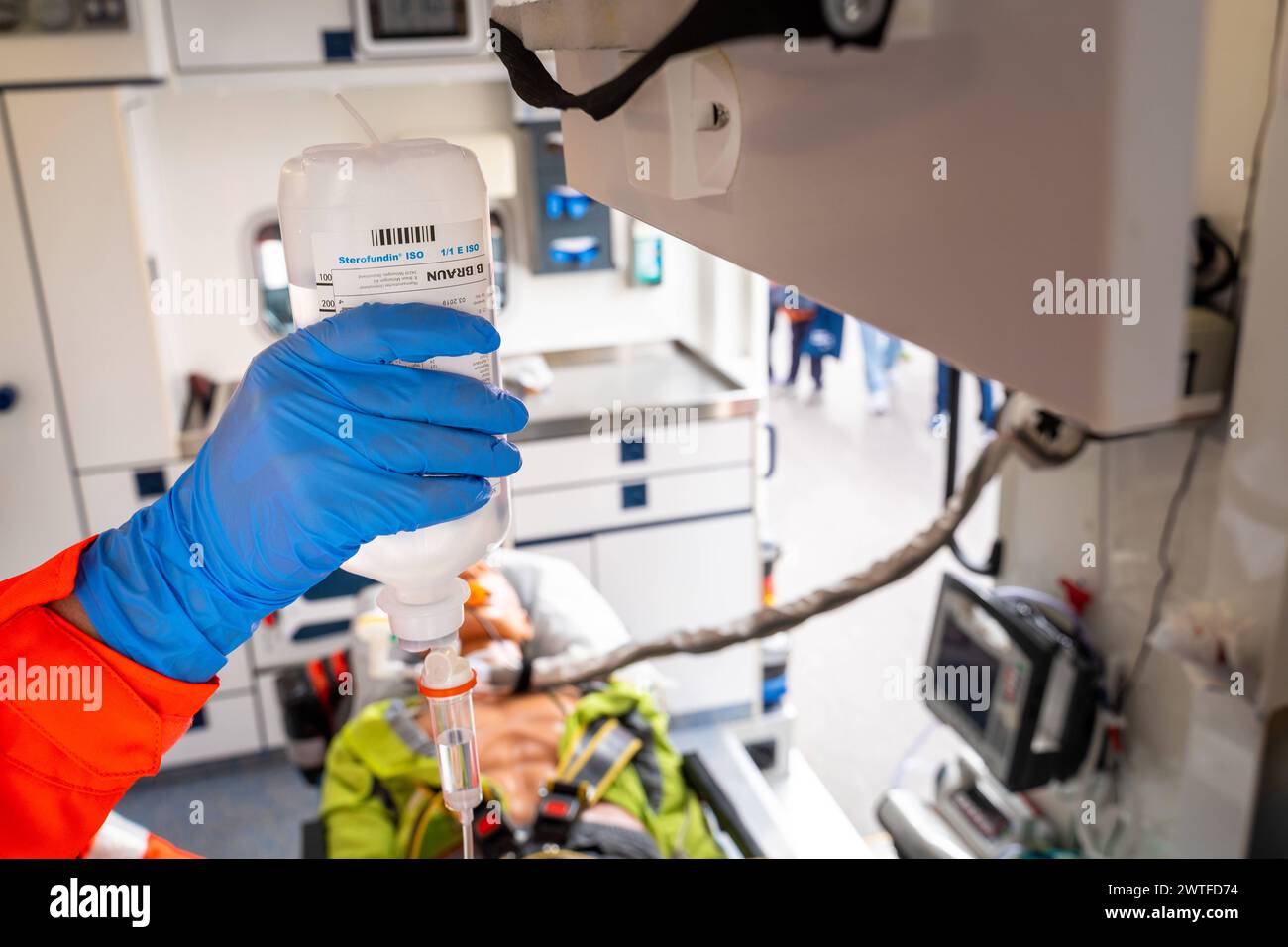 Schwabmünchen, Bavaria, Germany - March 17, 2024: A paramedic holds an ...