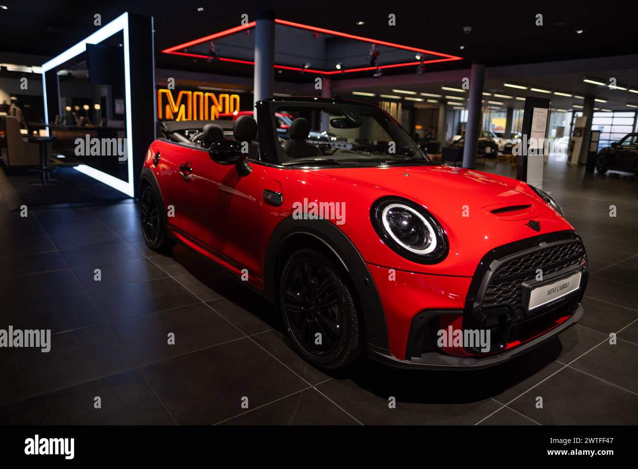 Red MINI Cooper Cabrio in showroom, automotive concern BMW Group ...