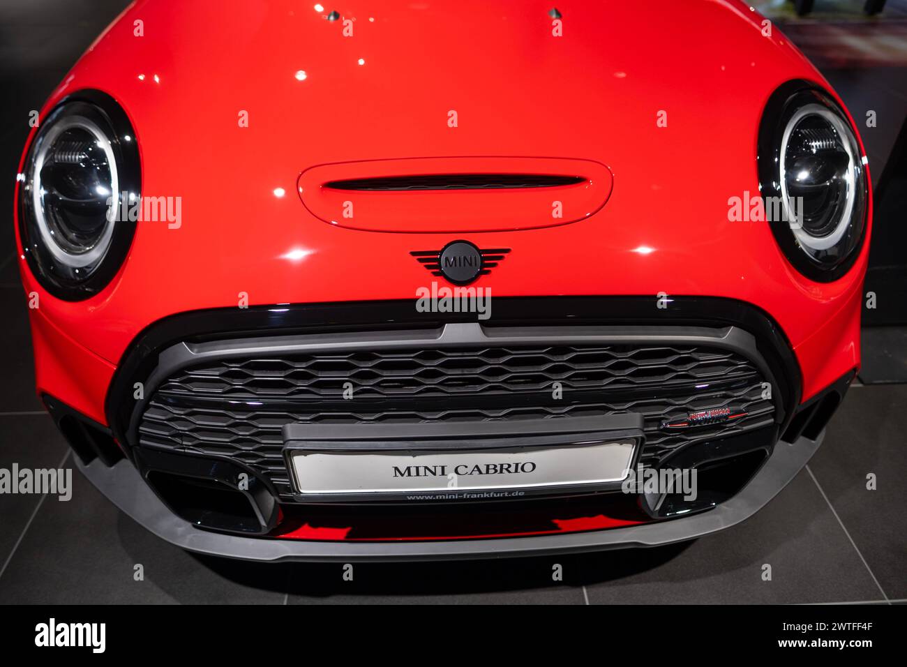 Red MINI Cooper Cabrio in showroom, automotive concern BMW Group ...