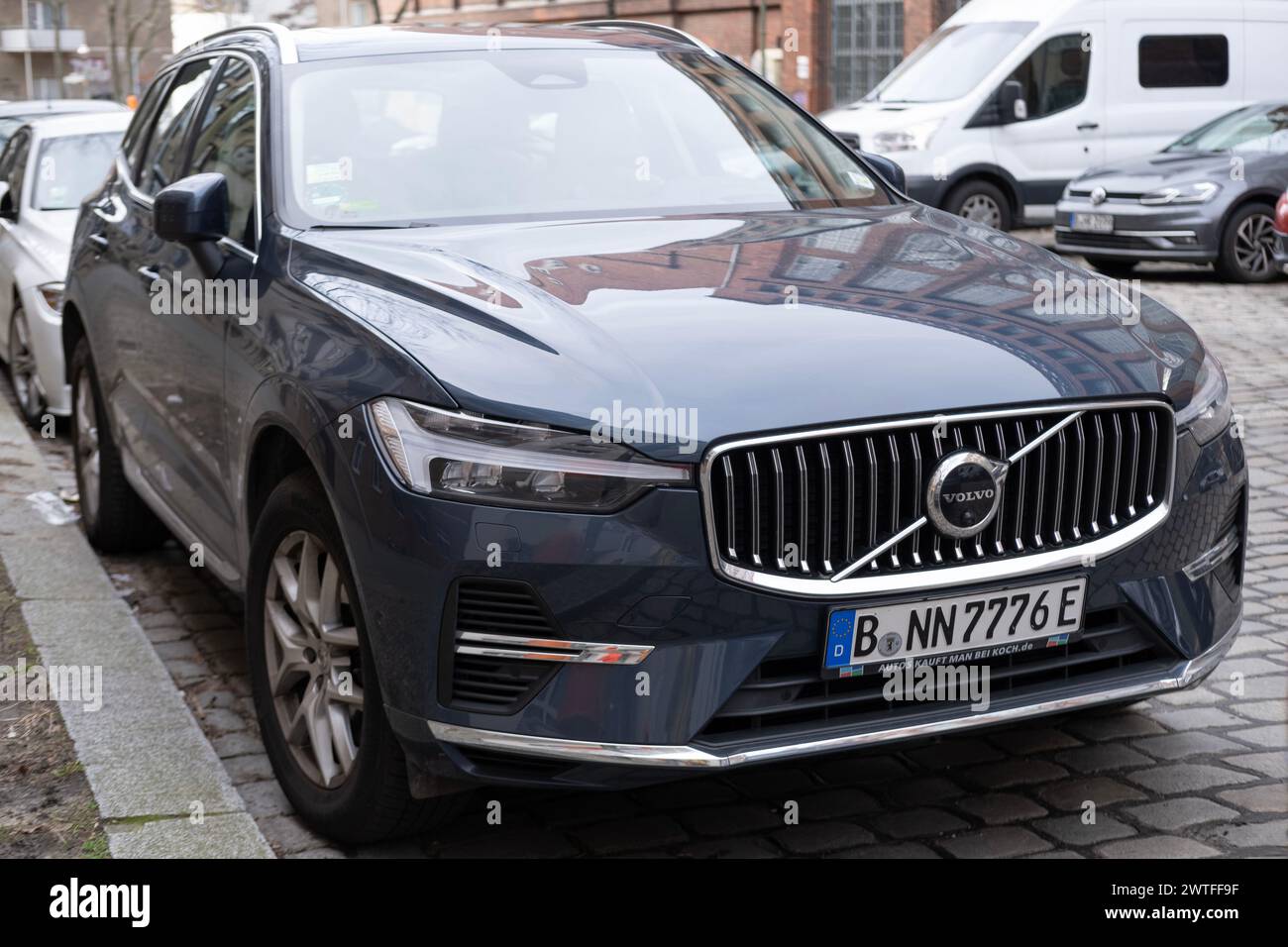 blue Volvo XC60 Recharge Plug-in Hybrid SUV parked on street in Berlin ...