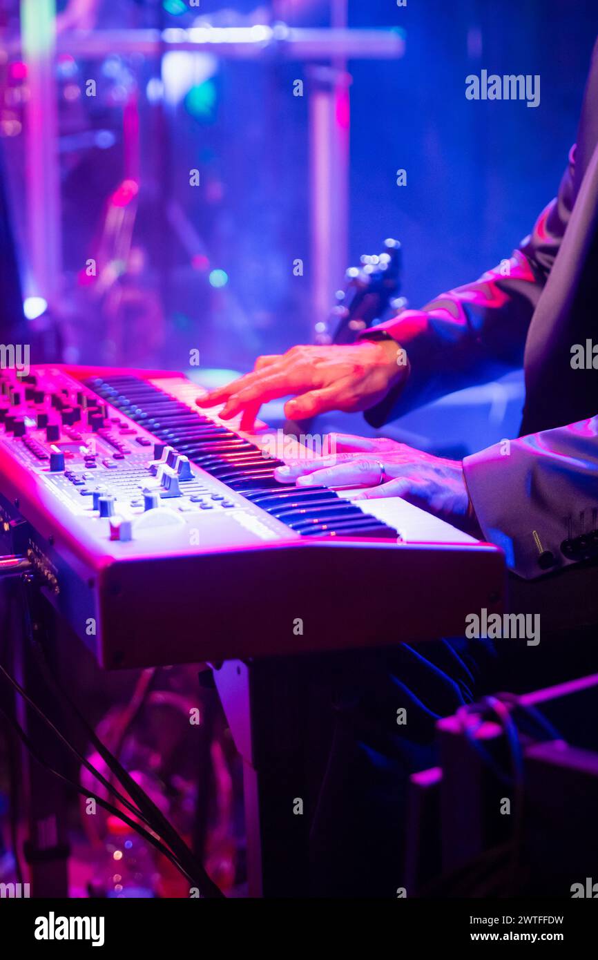 Playing piano at a rock concert under a stomboscopic lighting Stock ...