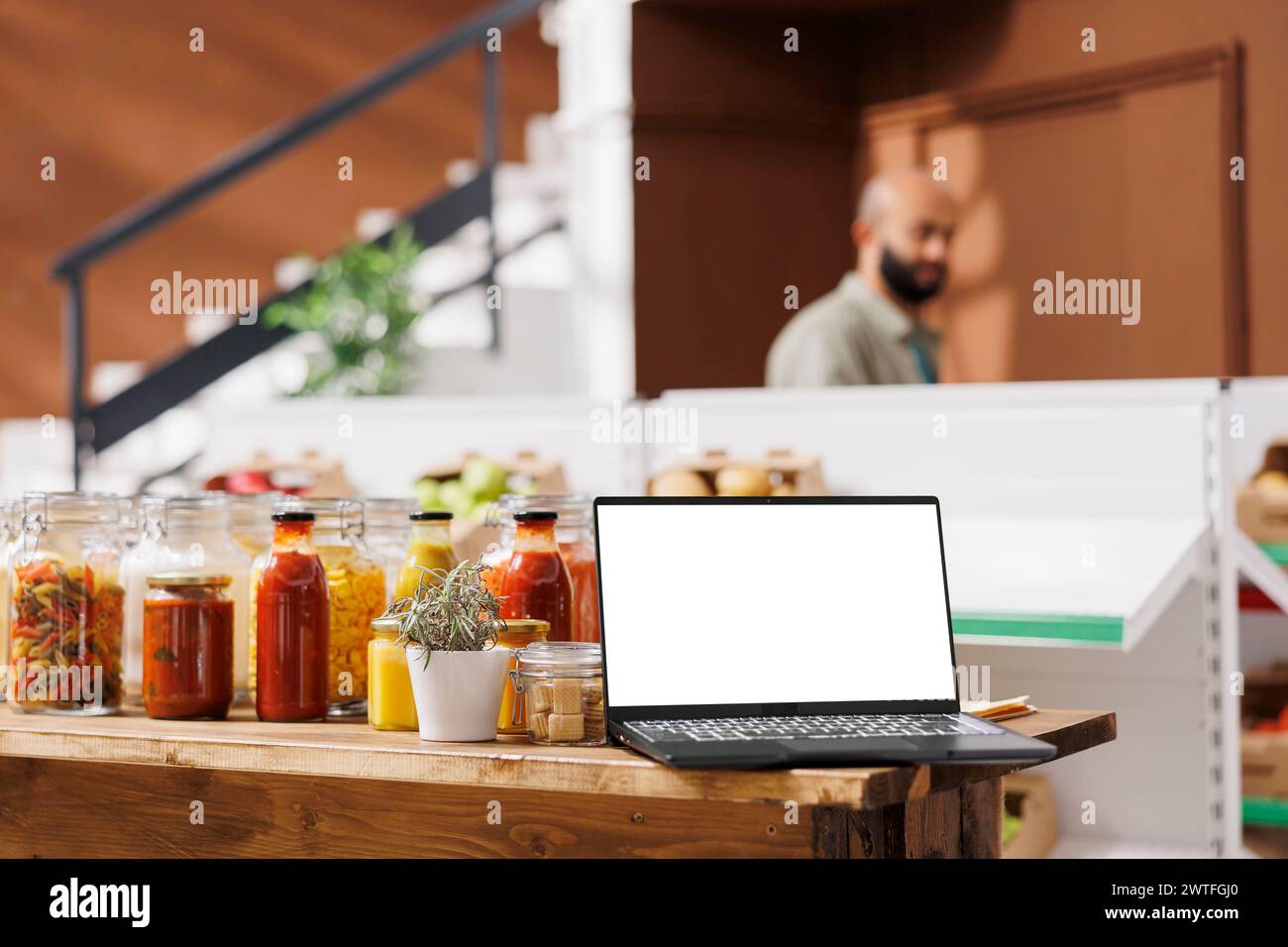 Wireless computer displaying white screen in bio shop filled with ...