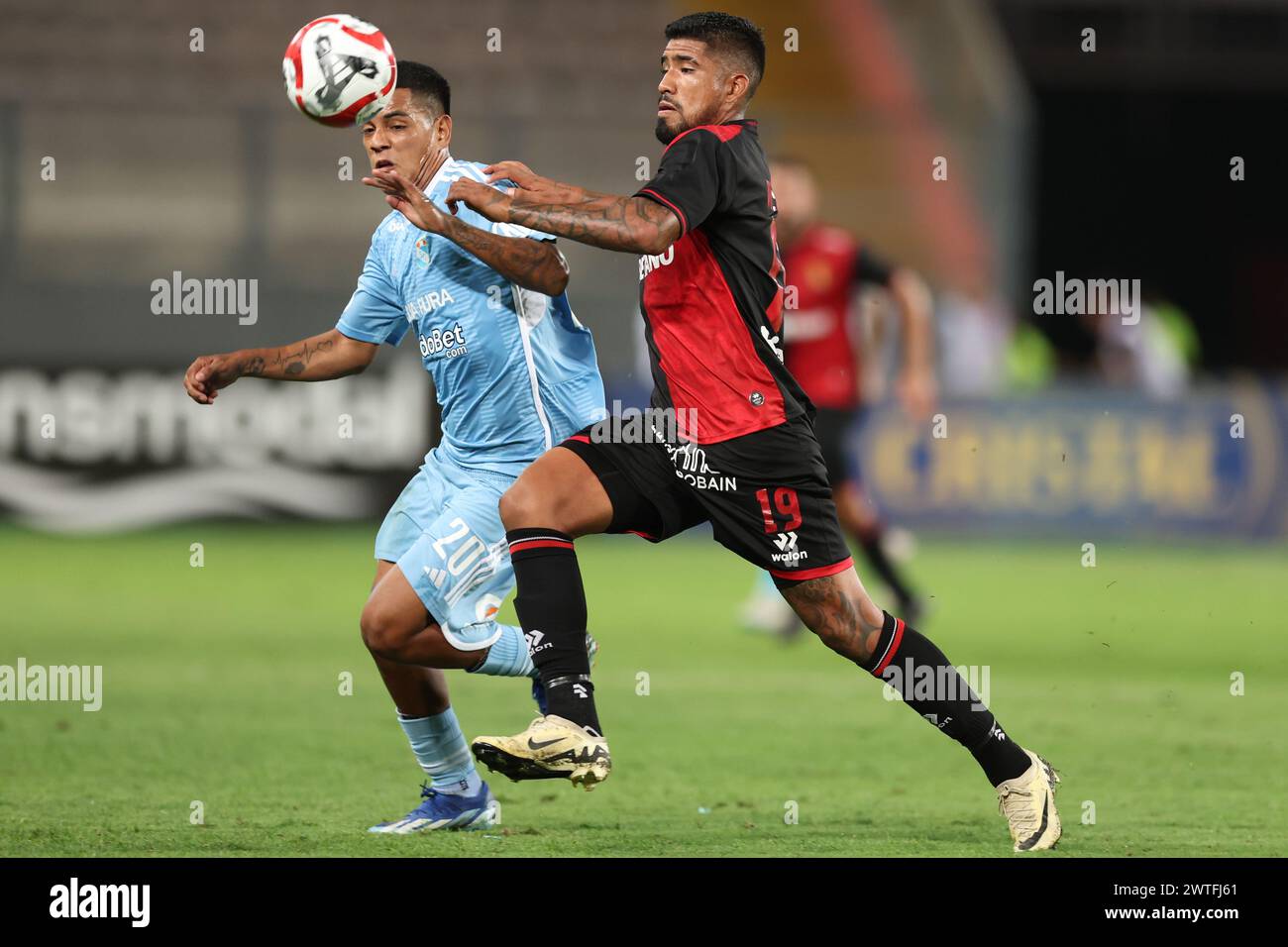 Lima, Peru. 14th Mar, 2024. Paolo Reyna of Melgar and Joao Grimaldo of Sporting Cristal during ...