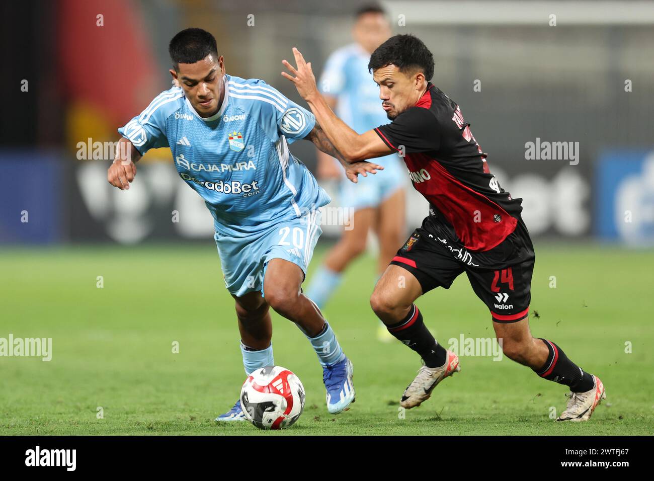 Lima, Peru. 14th Mar, 2024. Joao Grimaldo of Sporting Cristal and Walter Tandazo of Melgar ...