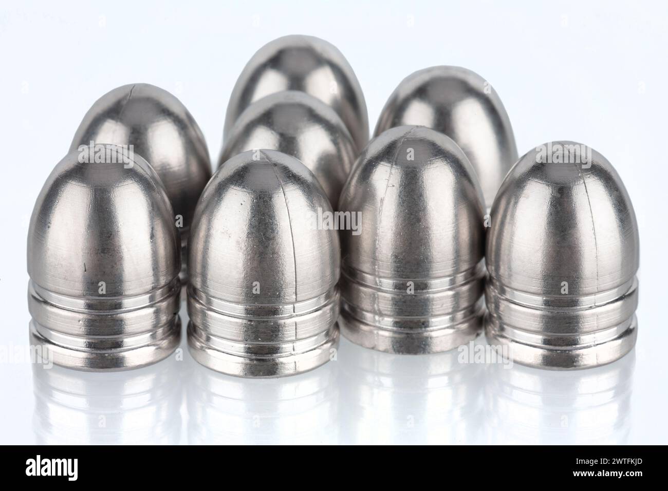 silver bullets for muzzle guns on white background Stock Photo - Alamy