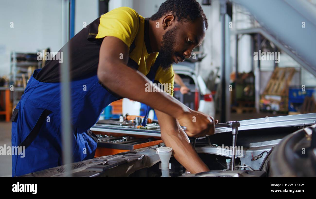 Knowledgeable employee in auto repair shop using virtual reality ...
