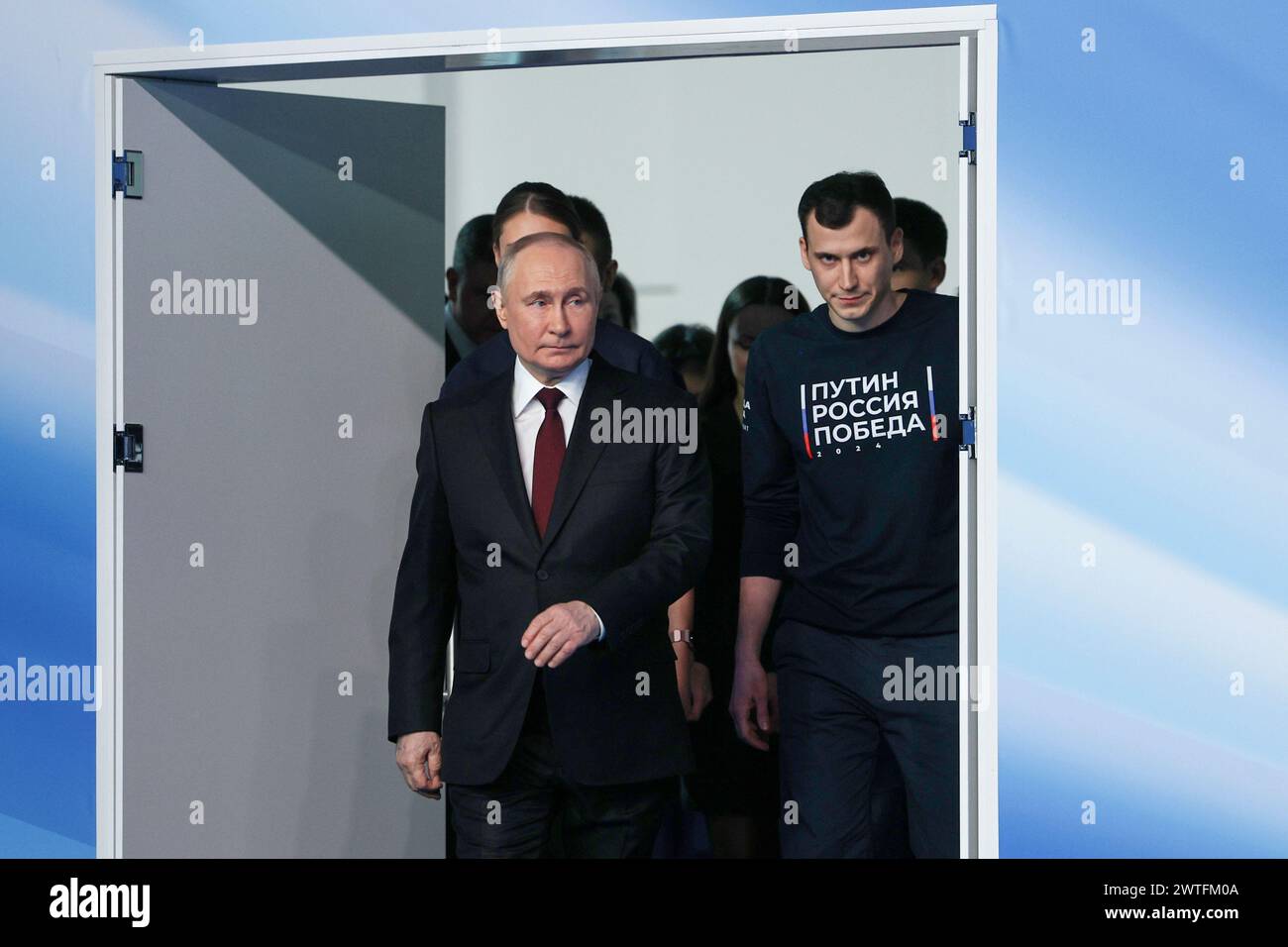 Russian President Vladimir Putin visits his campaign headquarters after ...