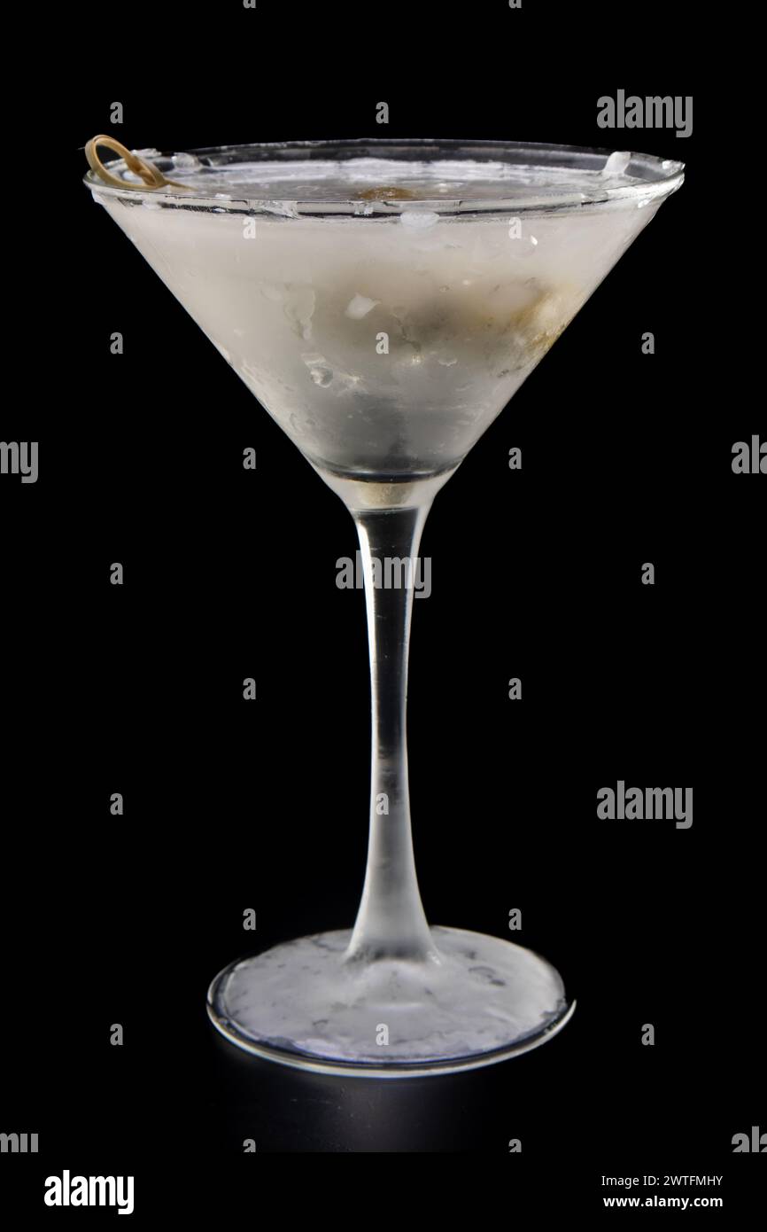 Chilled vodka martini with bleu cheese stuffed olives isolated over a ...