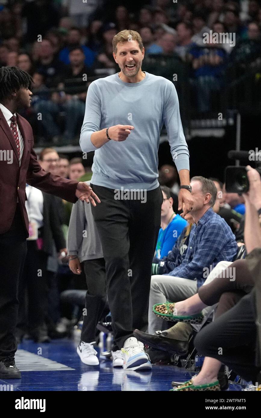Former Dallas Mavericks' Dirk Nowitzki walks the sidelines to his seat ...