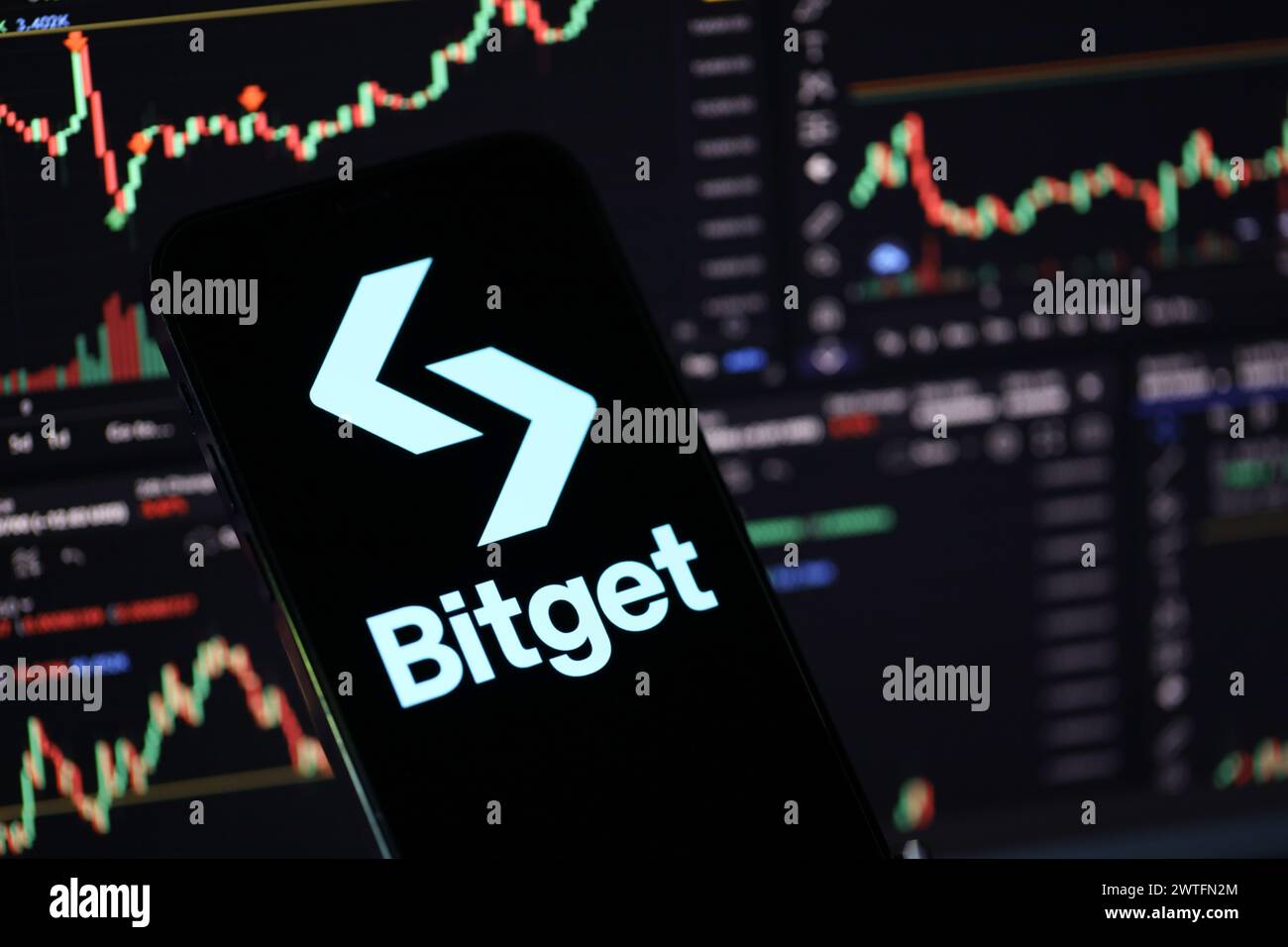 KYIV, UKRAINE - MARCH 15, 2024 Bitget logo on iPhone display screen and ...