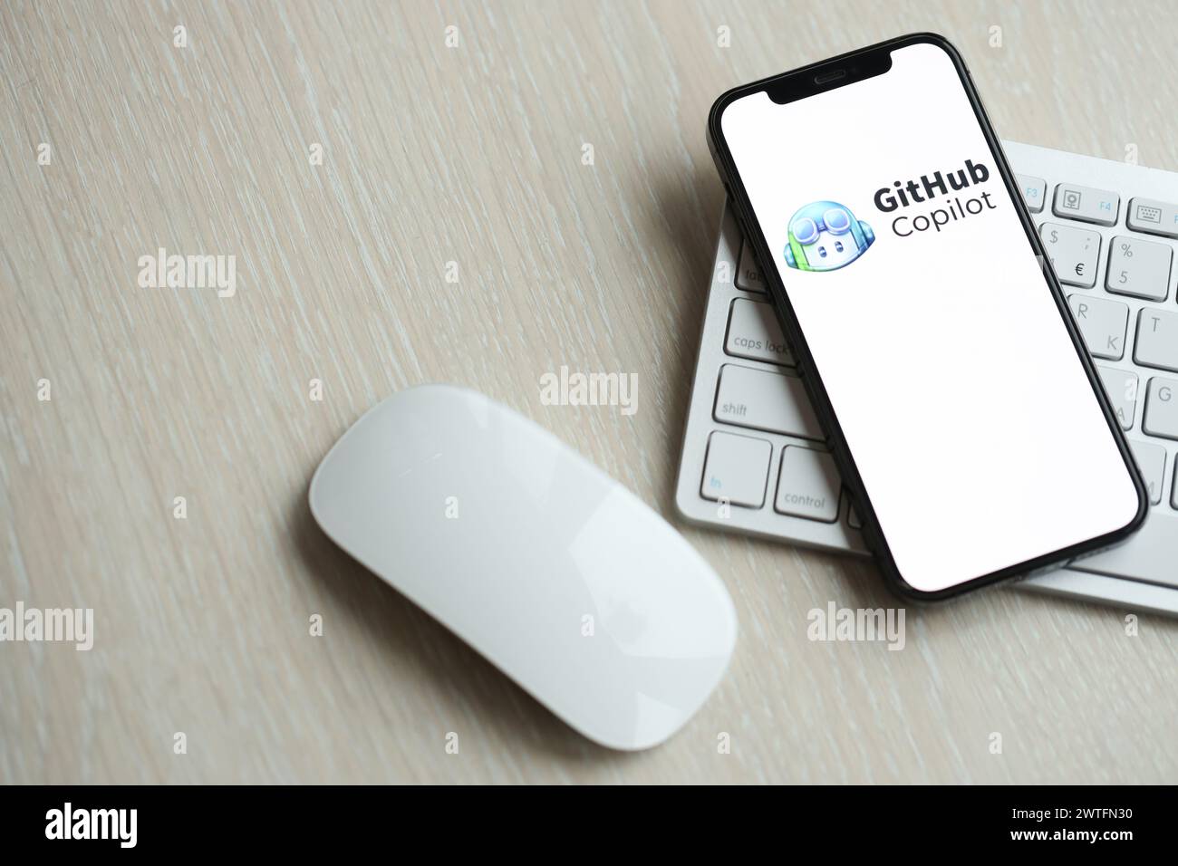 KYIV, UKRAINE - MARCH 17, 2024 Github copilot logo on iPhone display ...