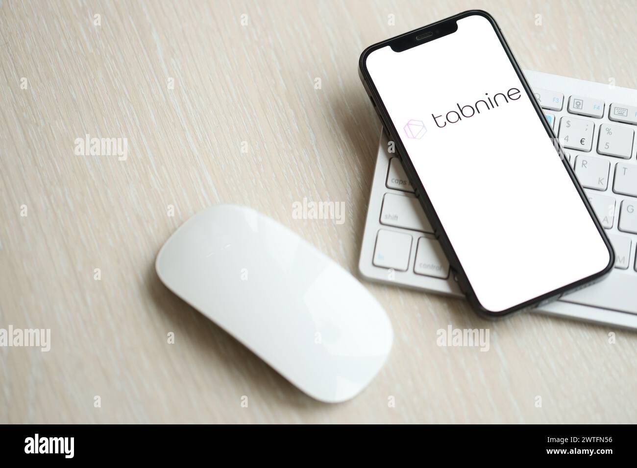 KYIV, UKRAINE - MARCH 17, 2024 Tabnine logo on iPhone display screen ...