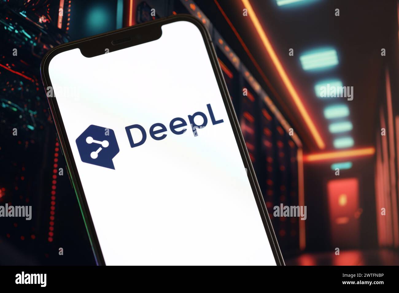 KYIV, UKRAINE - MARCH 17, 2024 DeepL logo on iPhone display screen with background of artificial ...