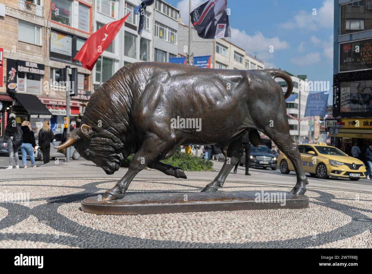ISTANBUL, TURKEY - MARCH 15, 2024: Famous bronze bull statue with icon ...