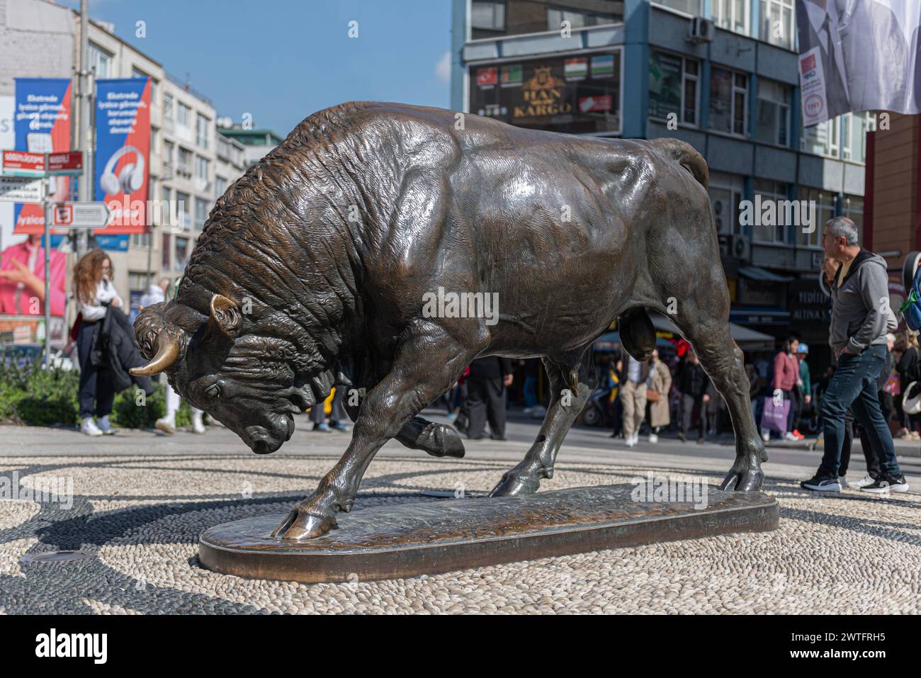 ISTANBUL, TURKEY - MARCH 15, 2024: Famous bronze bull statue with icon ...
