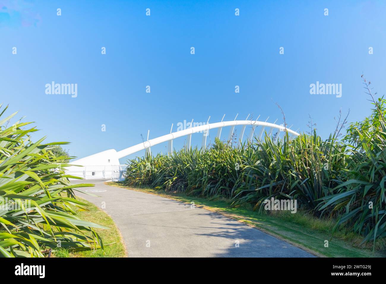 New Plymouth. New Zealand - March 1 2024; Cyclist crossing white steel ...