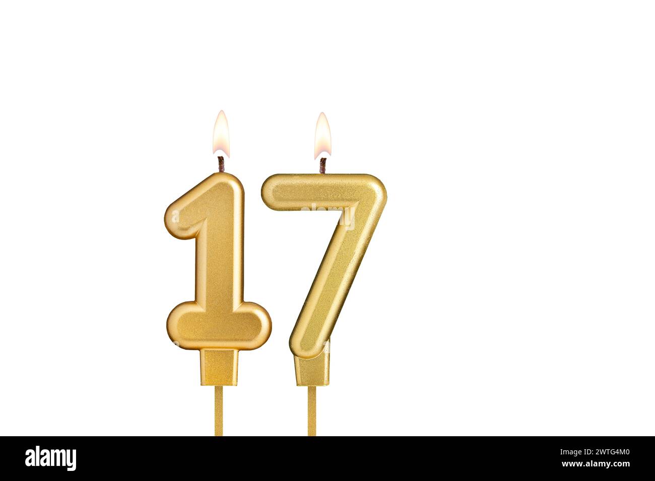 Golden number 17 birthday candle on white background Stock Photo - Alamy