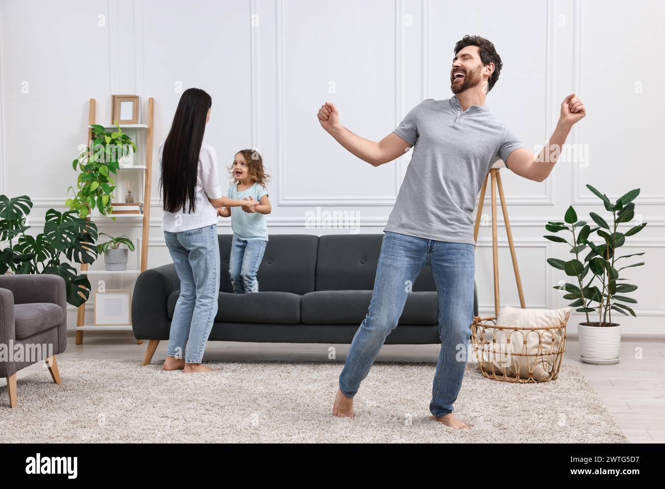 Cheerful girl dancing in living hi-res stock photography and images - Alamy