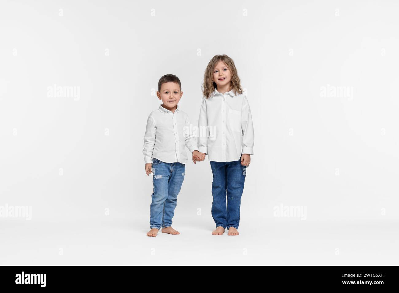 Cute little children on white background. Happy family Stock Photo - Alamy