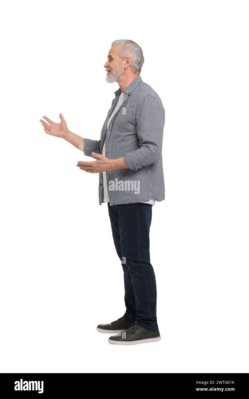 Senior man greeting someone on white background Stock Photo - Alamy