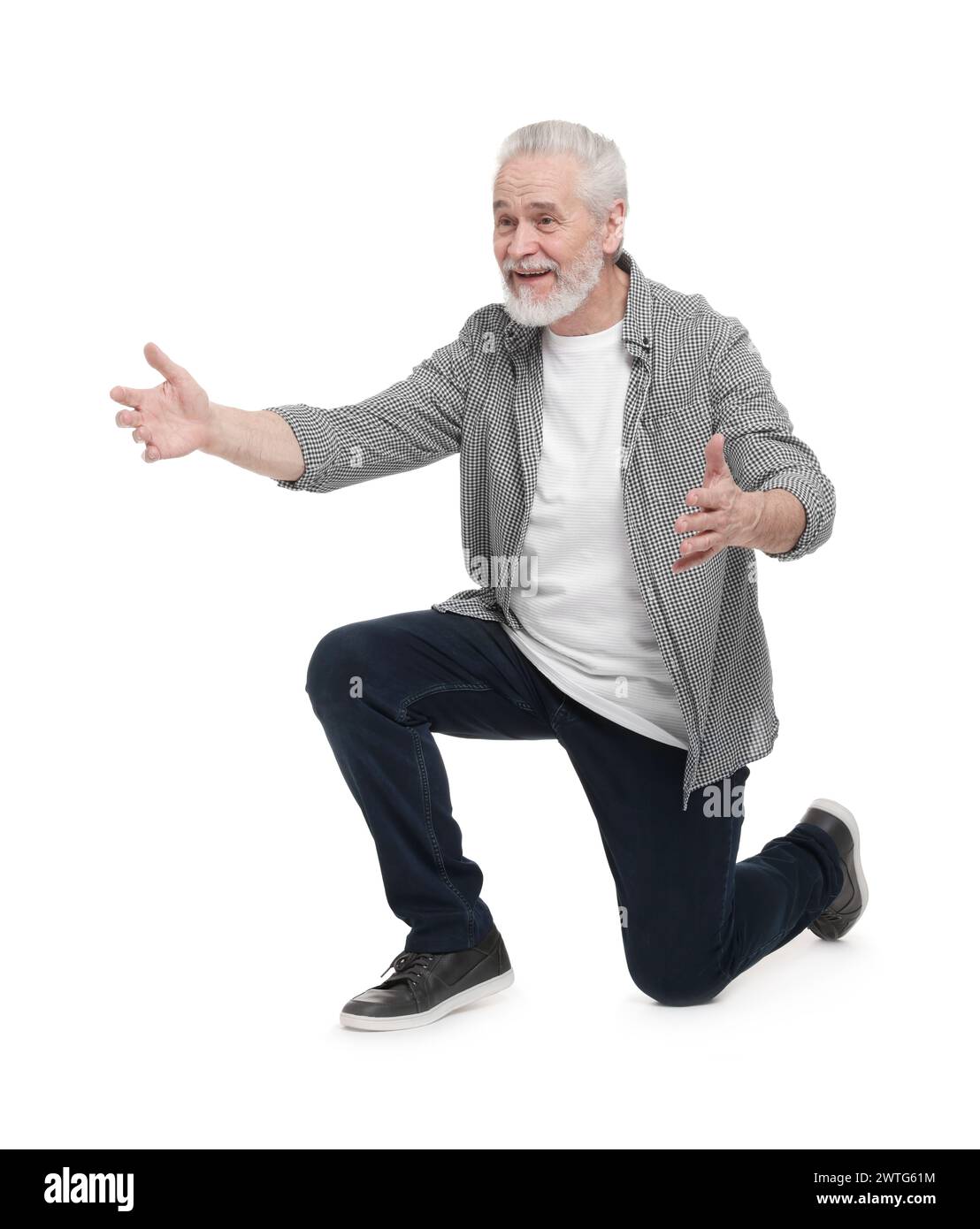 Senior man greeting someone on white background Stock Photo - Alamy