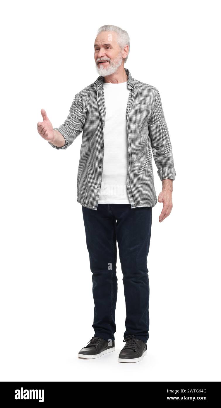 Senior man greeting someone on white background Stock Photo - Alamy