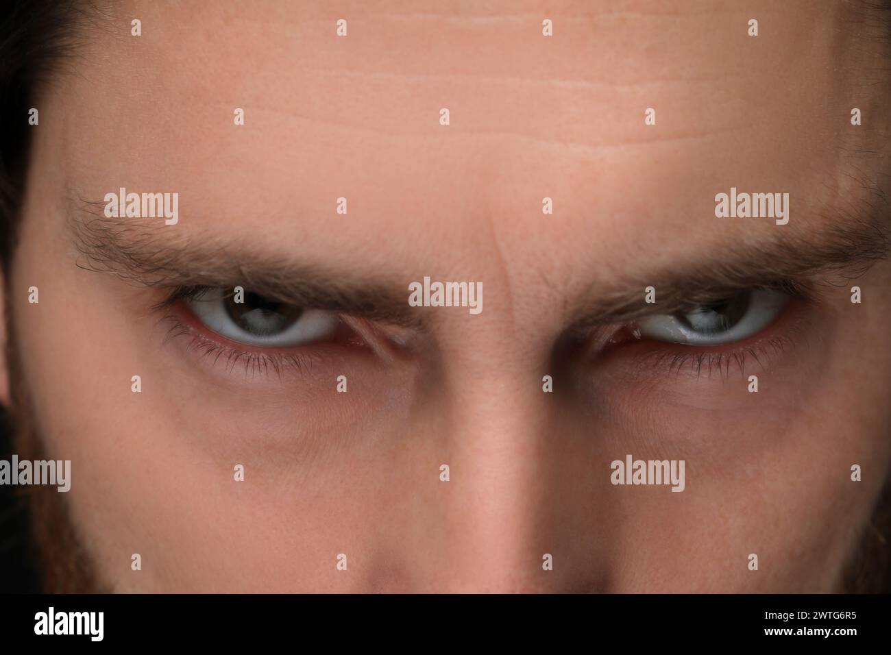 Evil eye. Man with scary eyes, closeup view Stock Photo - Alamy