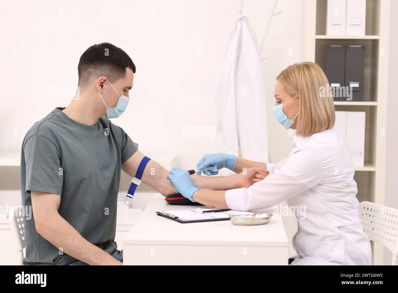 Woman taking medicine syringe from hi-res stock photography and images ...