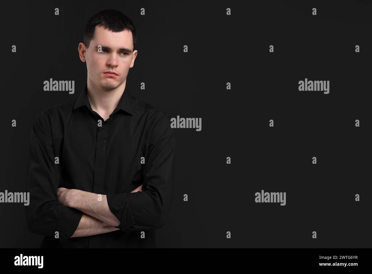 Portrait of sad man on black background, space for text Stock Photo - Alamy
