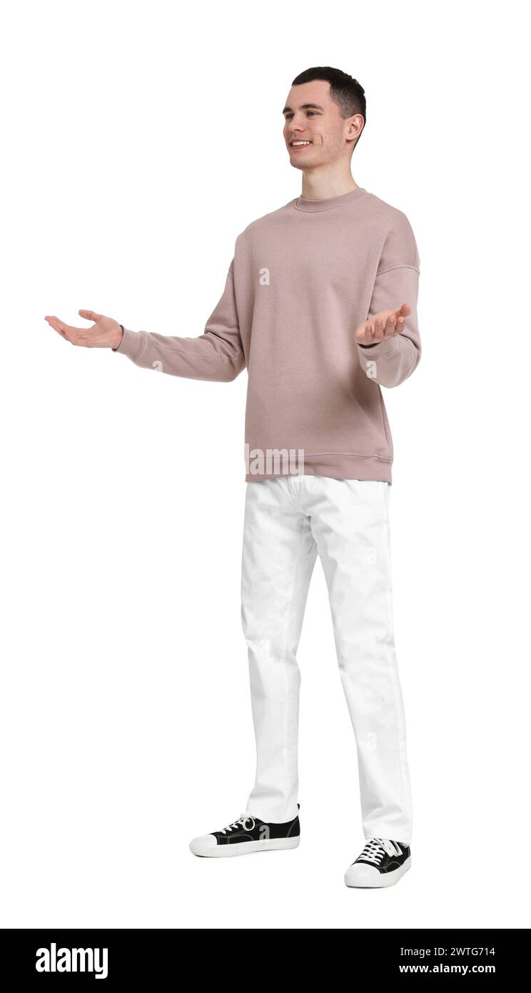 Handsome young man greeting someone on white background Stock Photo - Alamy