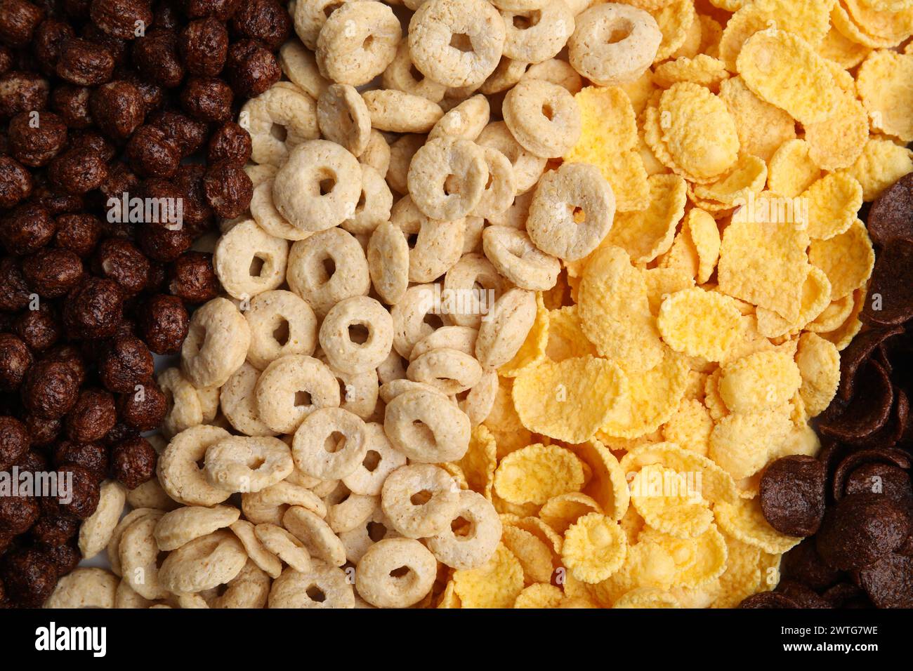 Different types of breakfast cereals as background, top view Stock ...