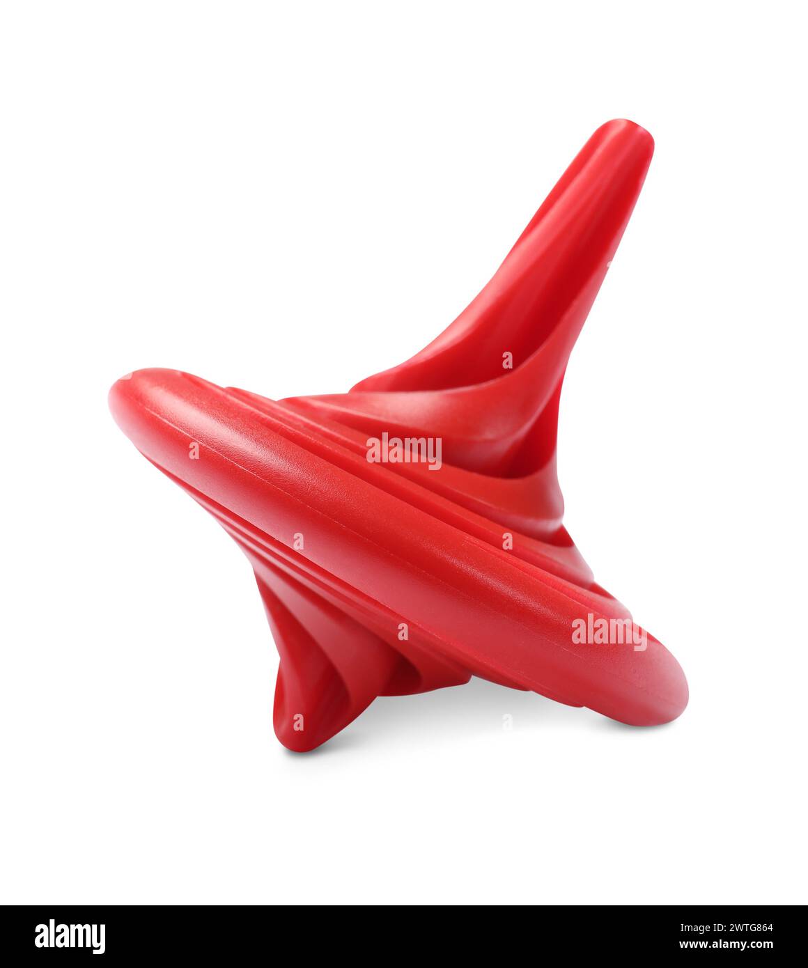 One red spinning top on white background Stock Photo - Alamy
