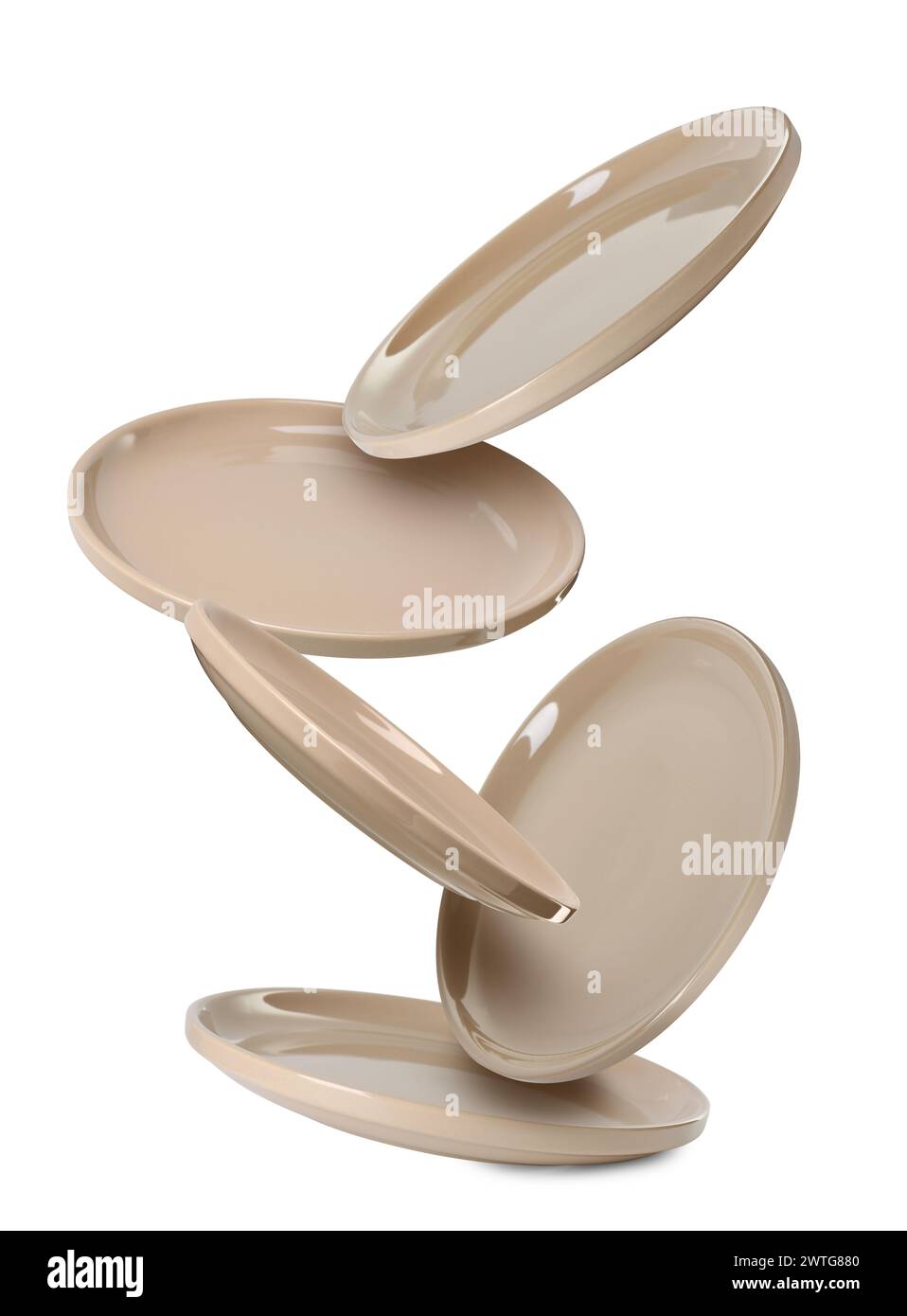 Clean ceramic plates falling on white background Stock Photo - Alamy