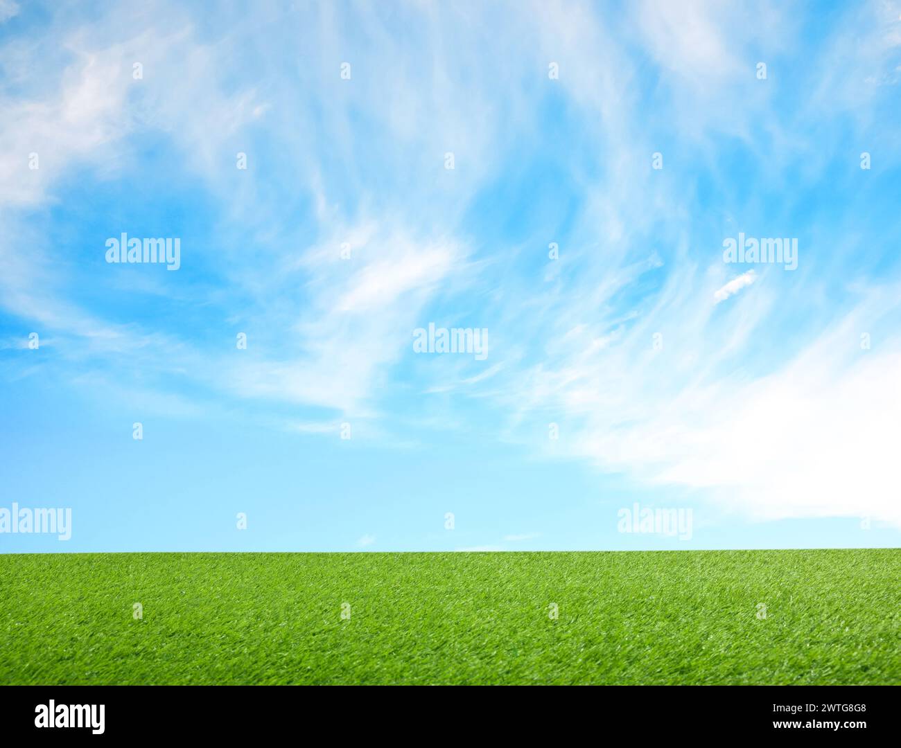 Green grass under blue sky with clouds Stock Photo - Alamy