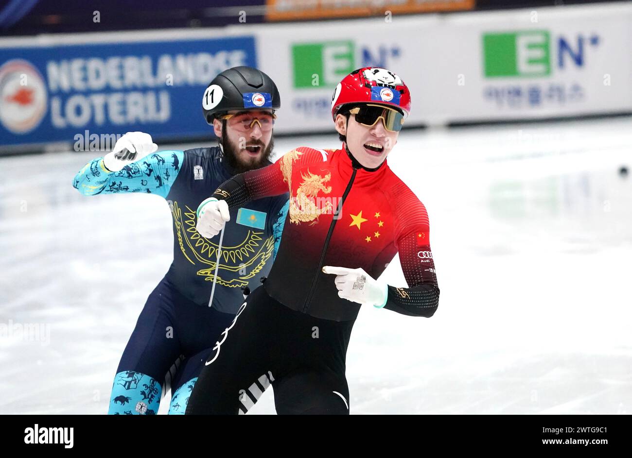 Xiaojun LIN (CHN) gold medallist 500m final, left Denis NIKISHA (KAZ) during ISU World Short ...
