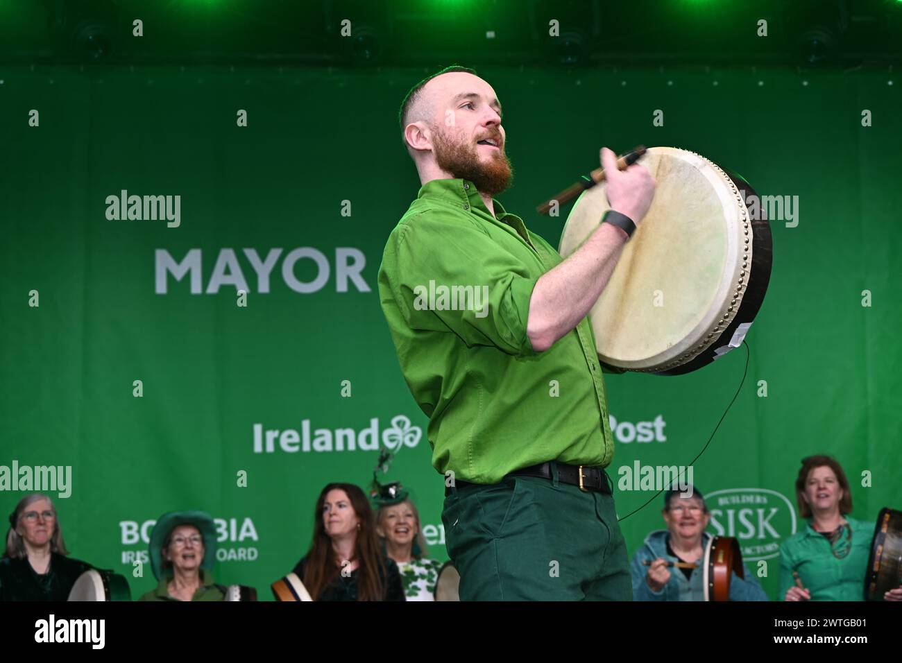 London, UK. 17th Mar, 2024. The London Bodhrán Band led by Ruairi ...