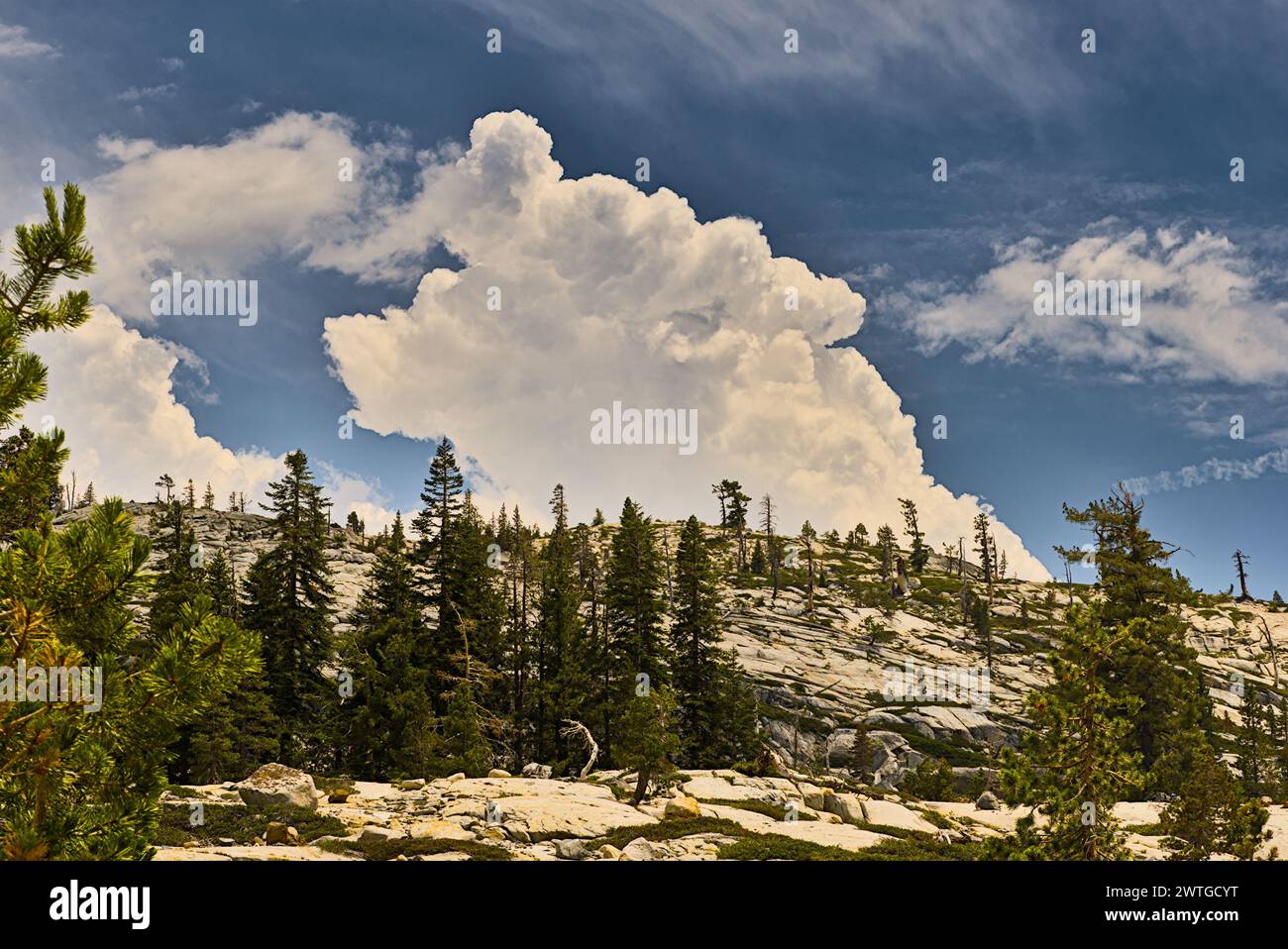 White cloud formation above the alpine mountain Stock Photo - Alamy