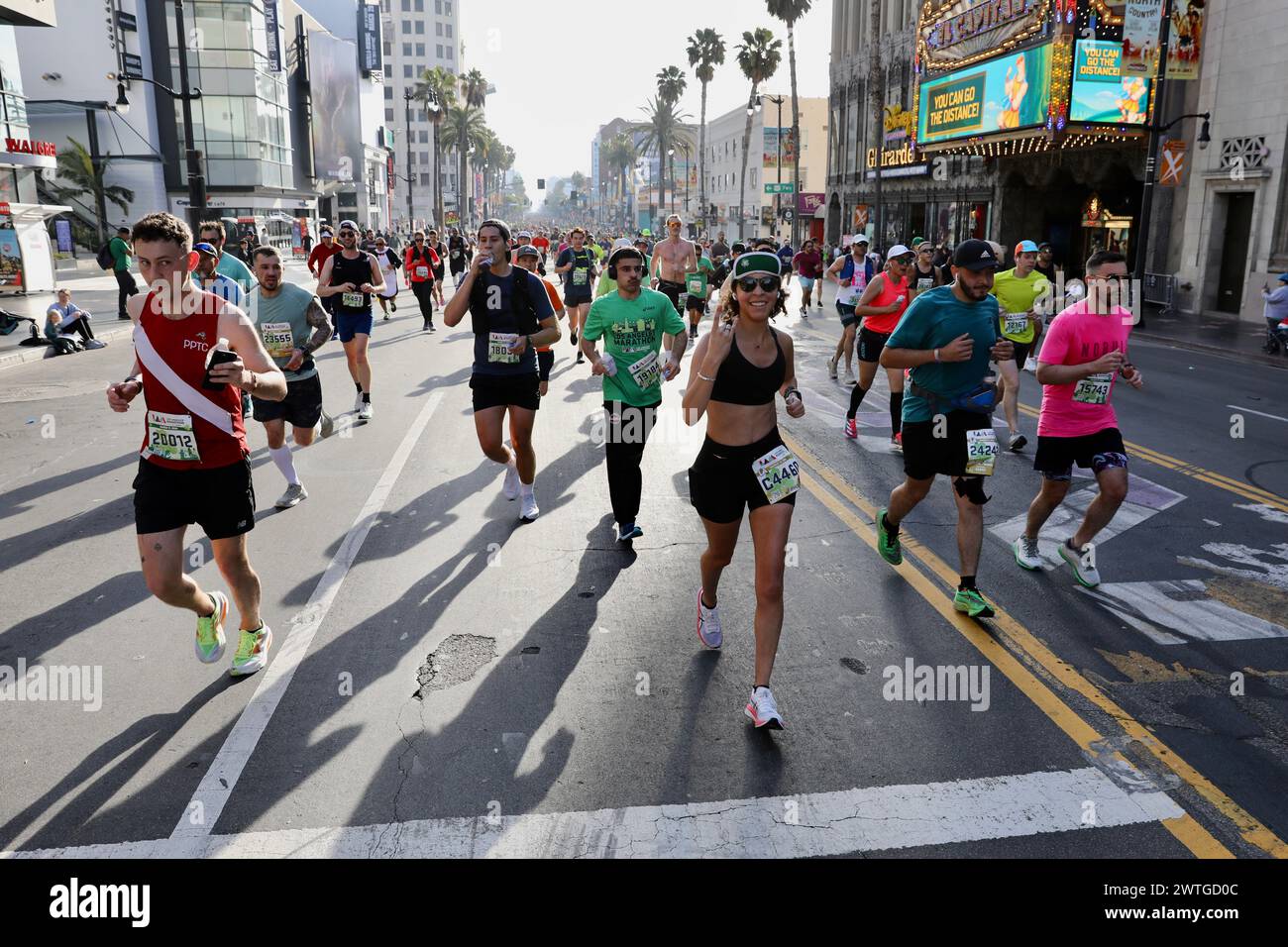 Los Angeles, USA. 18th Mar, 2024. A group of runners run along ...