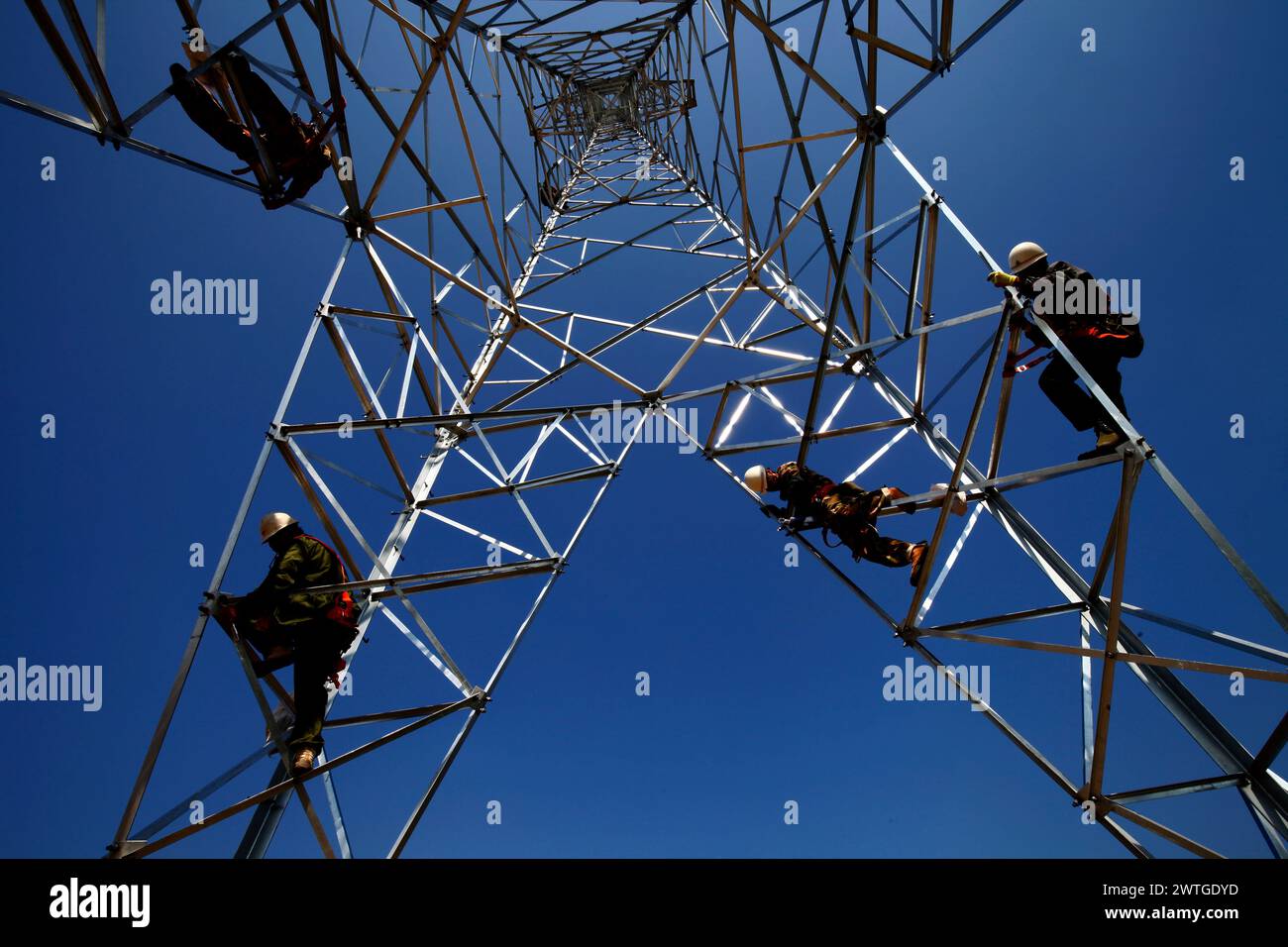 The workers of the pylon Stock Photo - Alamy