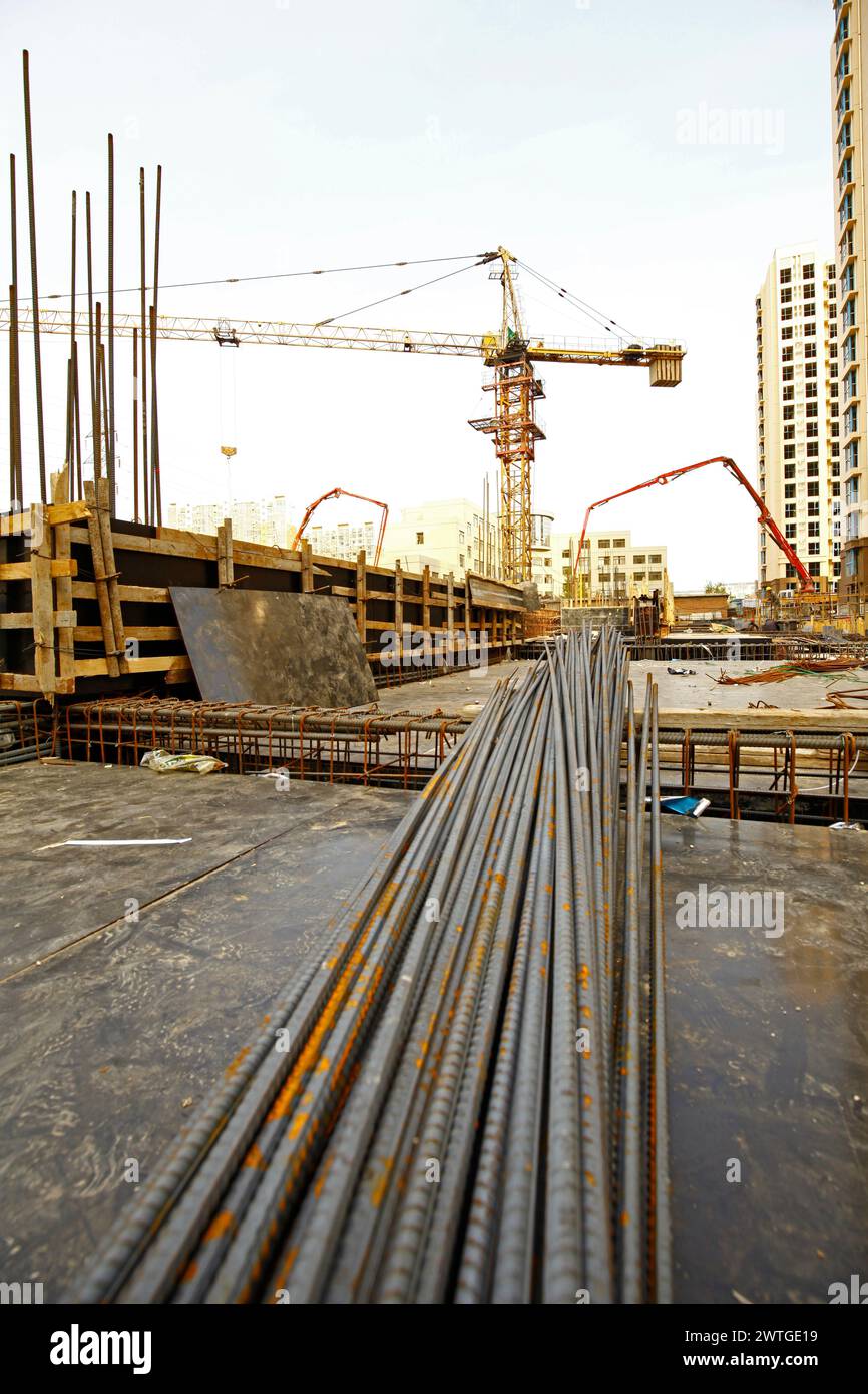 worker in the construction site making reinforcement metal framework ...