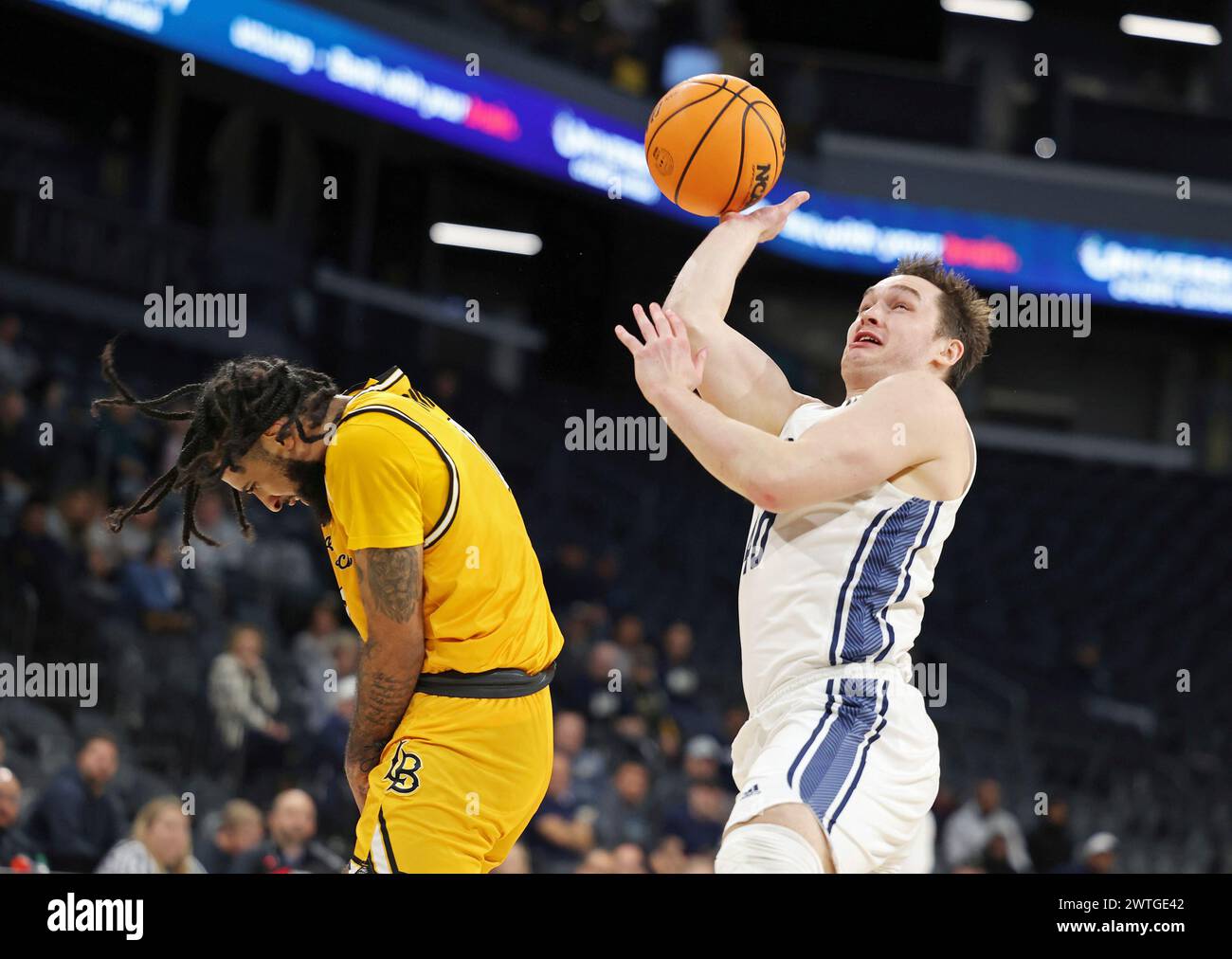 UC Davis guard Elijah Pepper (40) recoils after a being fouled near ...